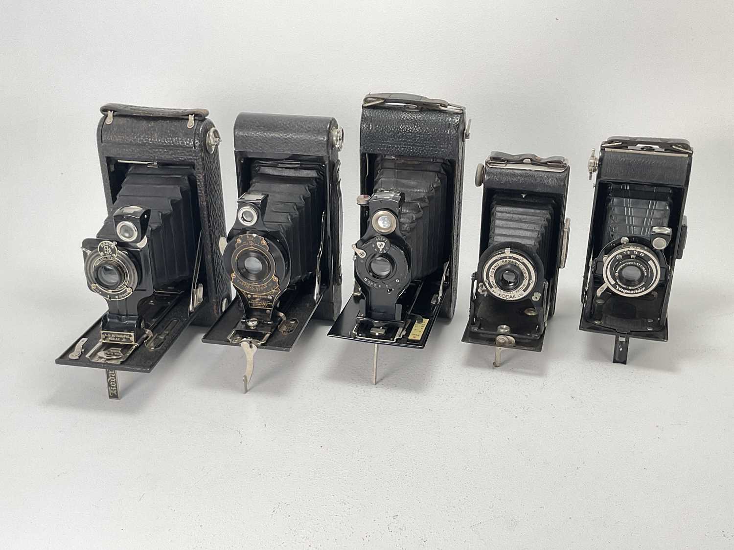 Lot 635 - A Selection of Five Folding Cameras,