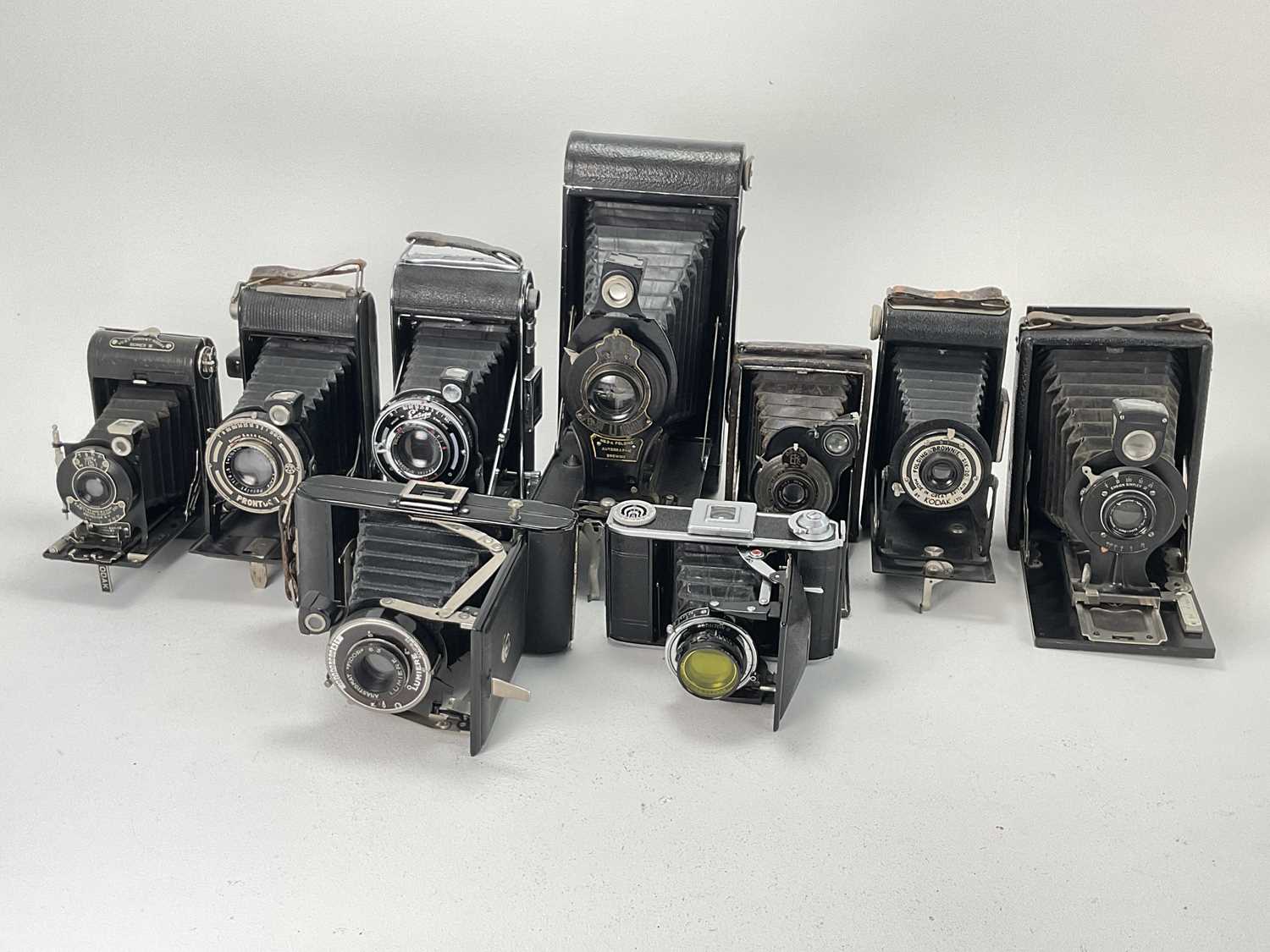Lot 648 - A Selection of 9 Folding Cameras,