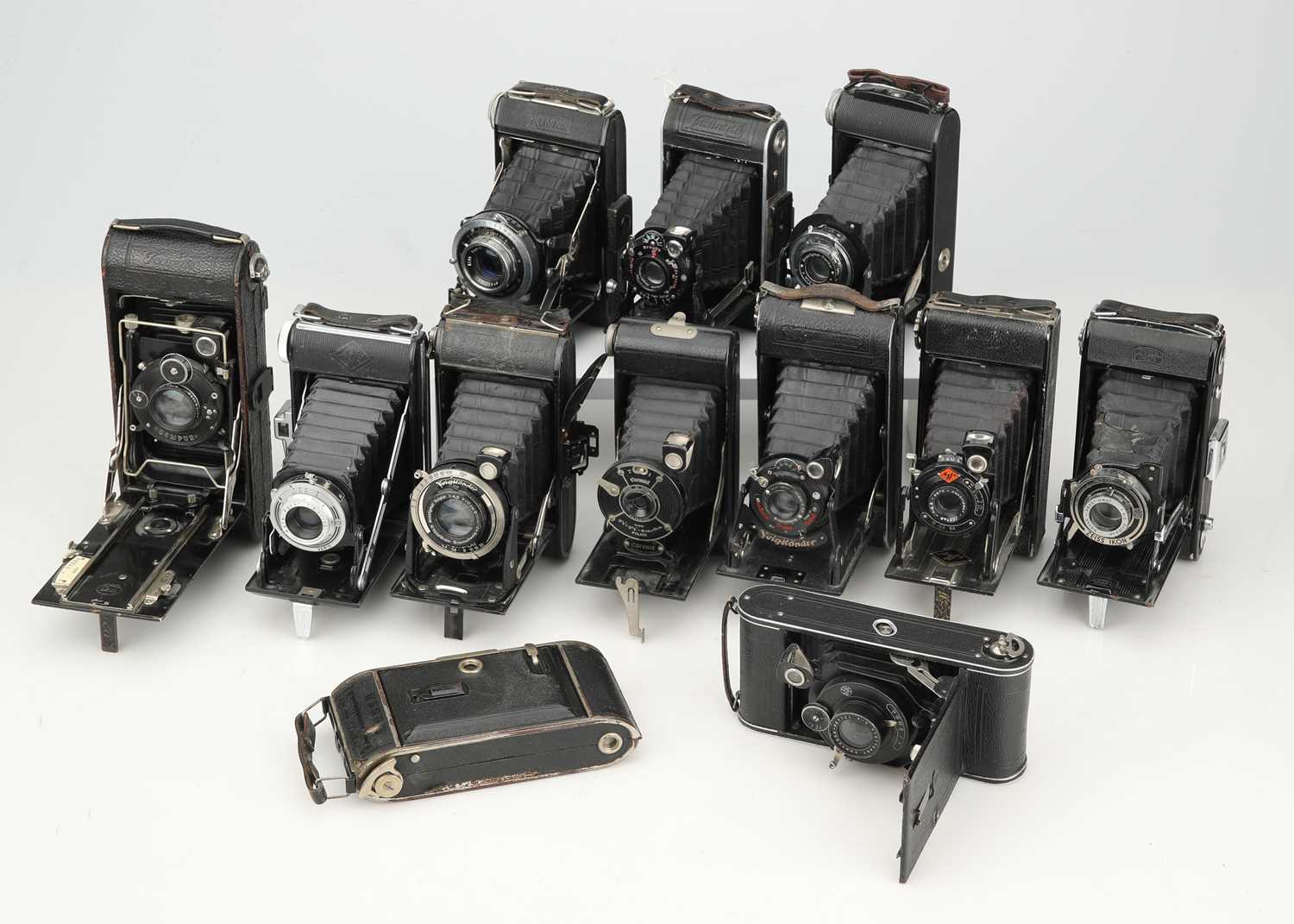 Lot 220 - A Selection of Twelve Folding Cameras,