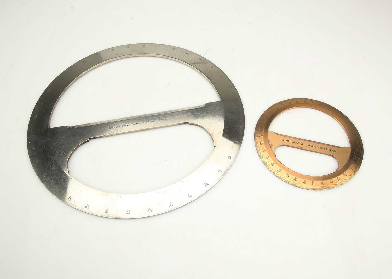 Lot 714 - Two Circular Protractors,