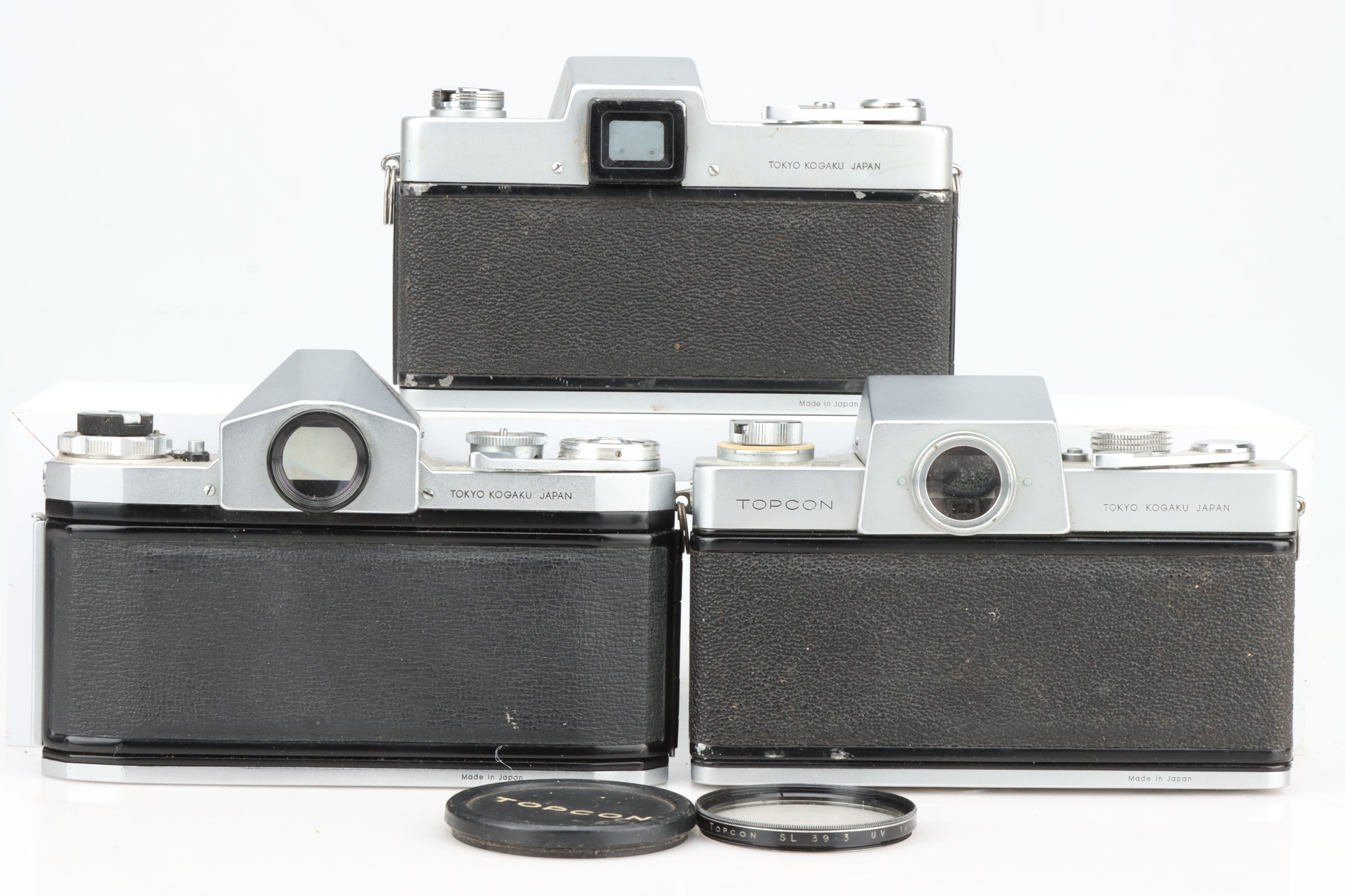 Lot 409 - Three Topcon SLR Cameras,