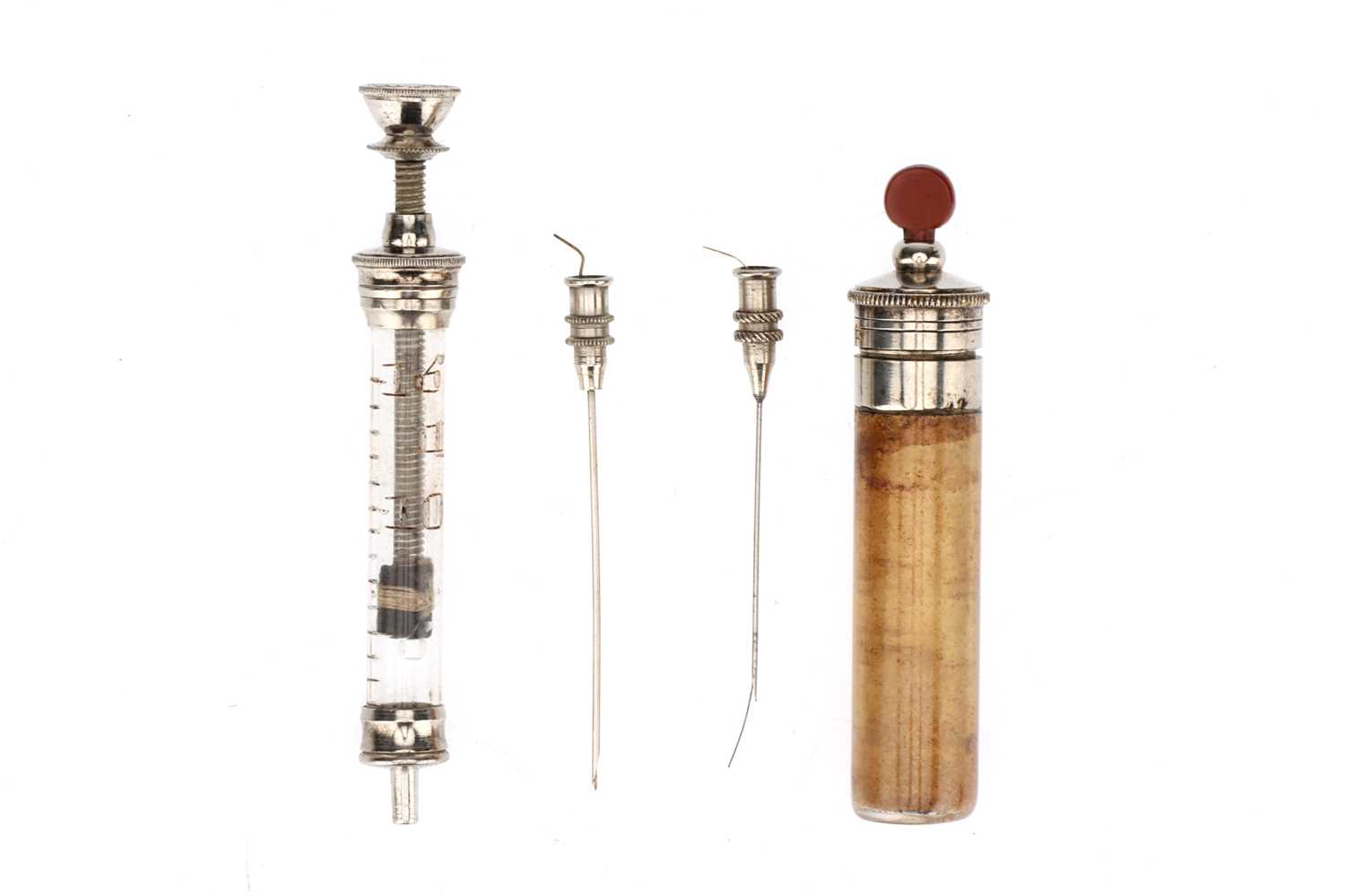 Lot 133 - A Decorative Opiate Syringe Set,
