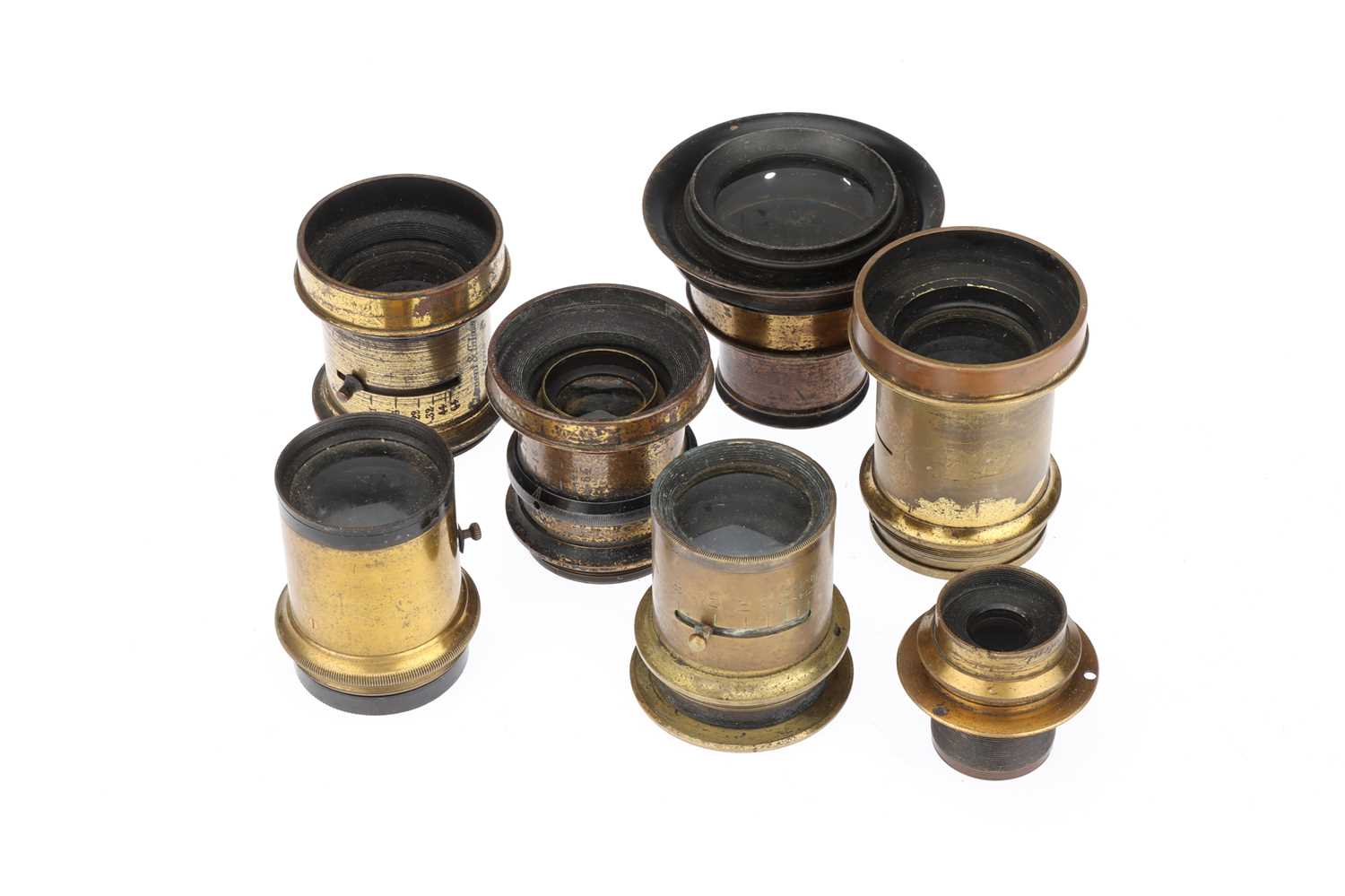 Lot 669 - A Collection of Seven Brass Camera Lenses,