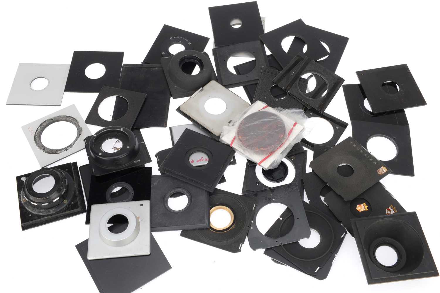 Lot 558 - A Large Quantity of Lens Boards and Mounts,