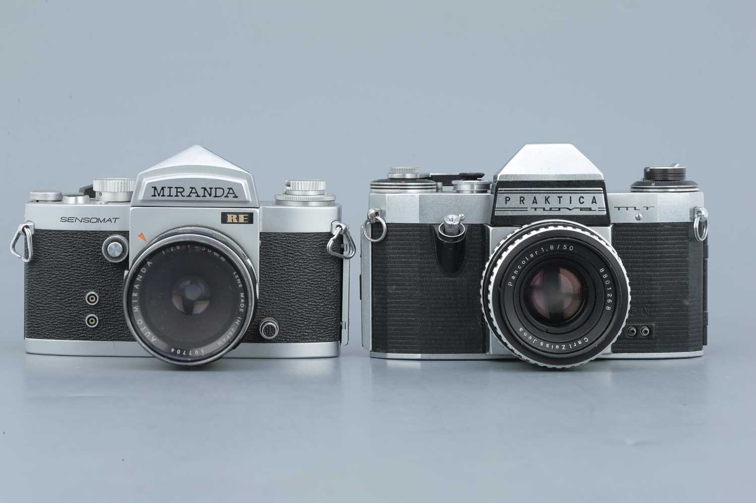 Lot 384 - A Selection of Various SLR Cameras,